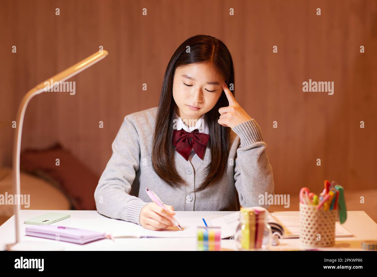 Japanese high school student in uniform studying Stock Photo - Alamy