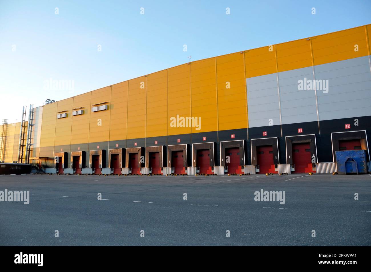 Modern logistics warehouse complex. Loading gate. Garbage container ...
