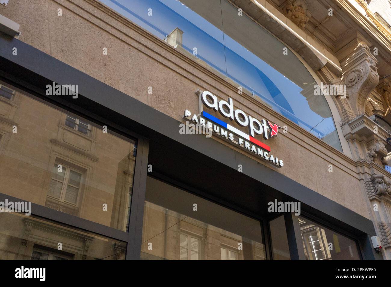 Bordeaux , Aquitaine France - 04 07 2023 : adopt sign text and brand ...