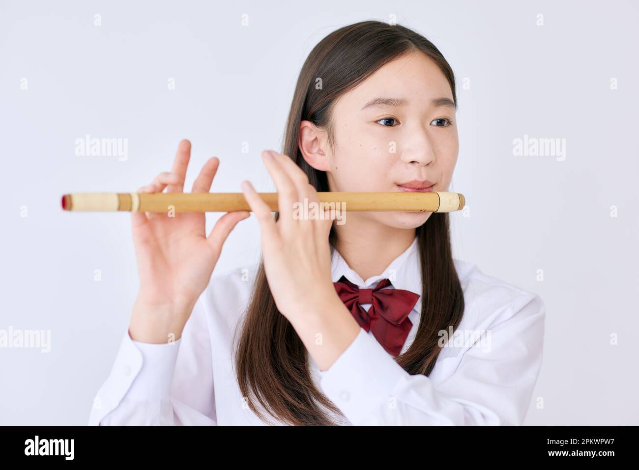 Japanese high school student wearing uniform practicing music Stock ...