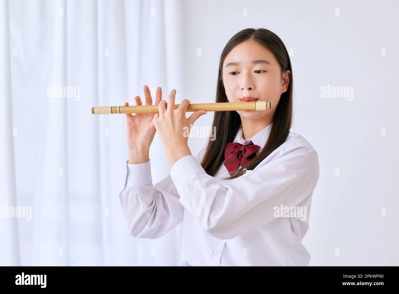Japanese high school student wearing uniform practicing music Stock ...