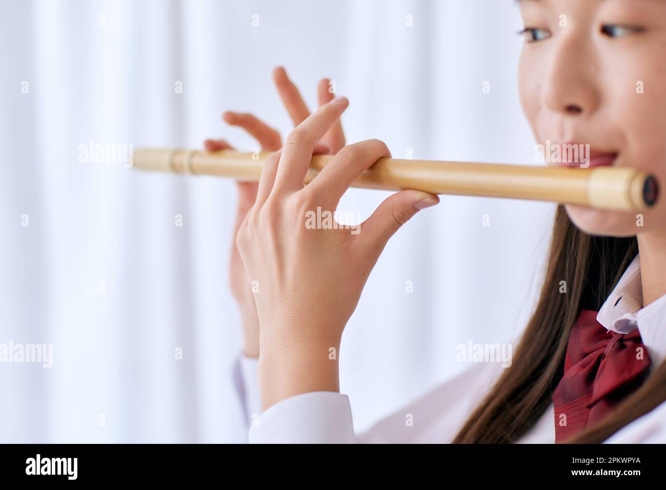 Japanese high school student wearing uniform practicing music Stock ...