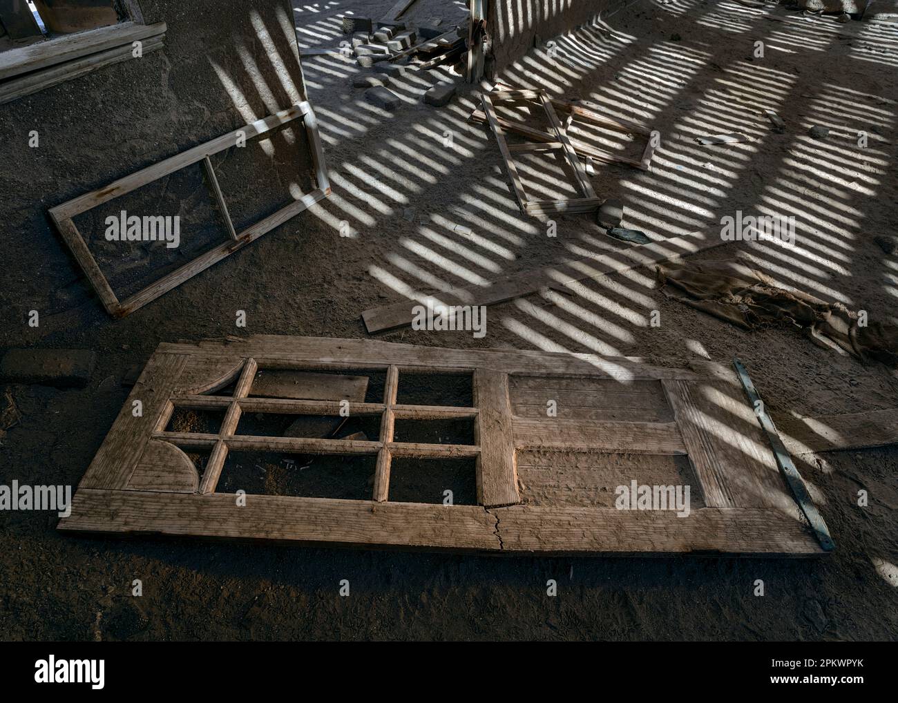A fallen door lies in the old community hall of the diamond ghost town ...