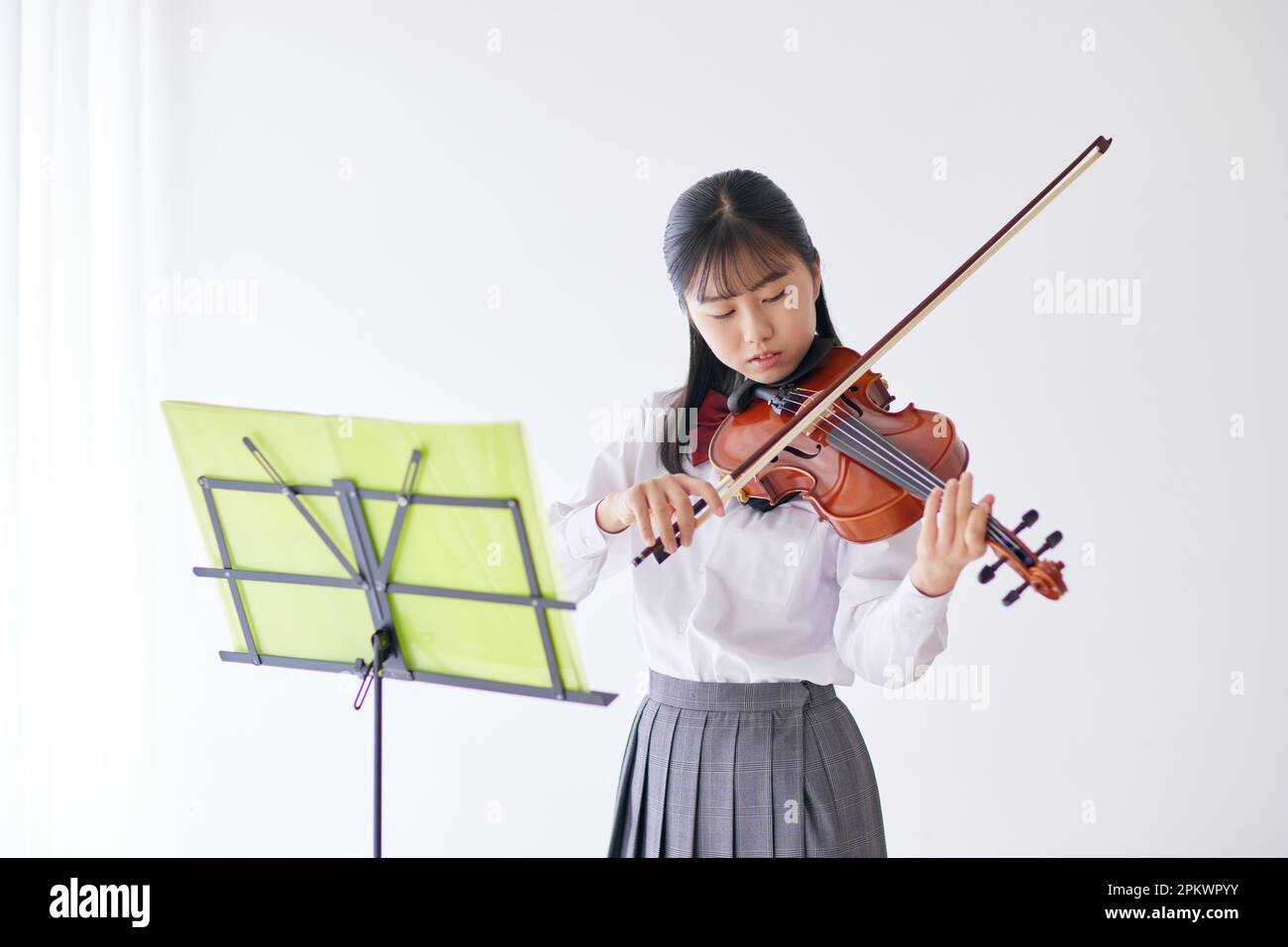 Japanese high school student wearing uniform practicing music Stock ...