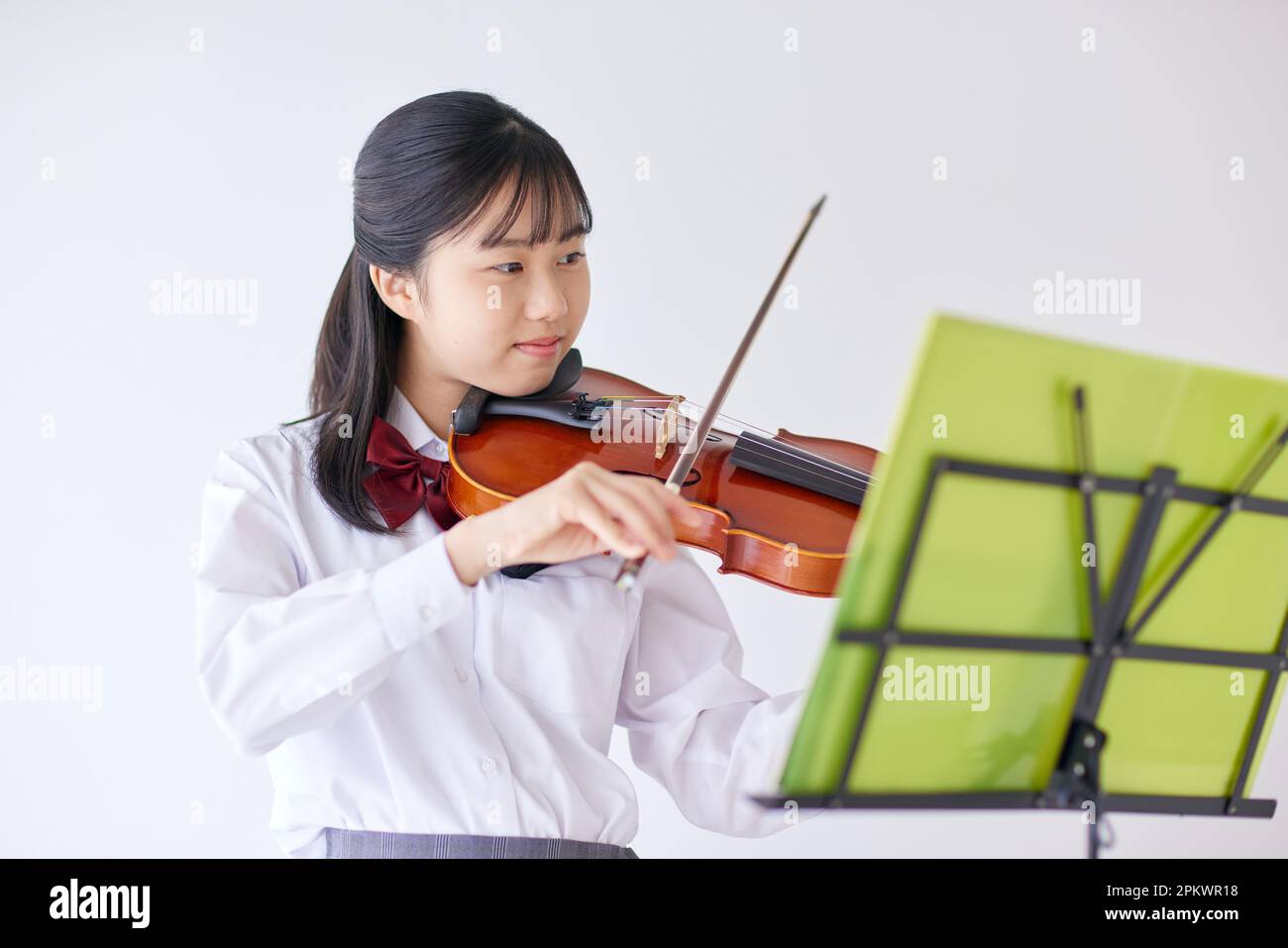 Japanese high school student wearing uniform practicing music Stock ...