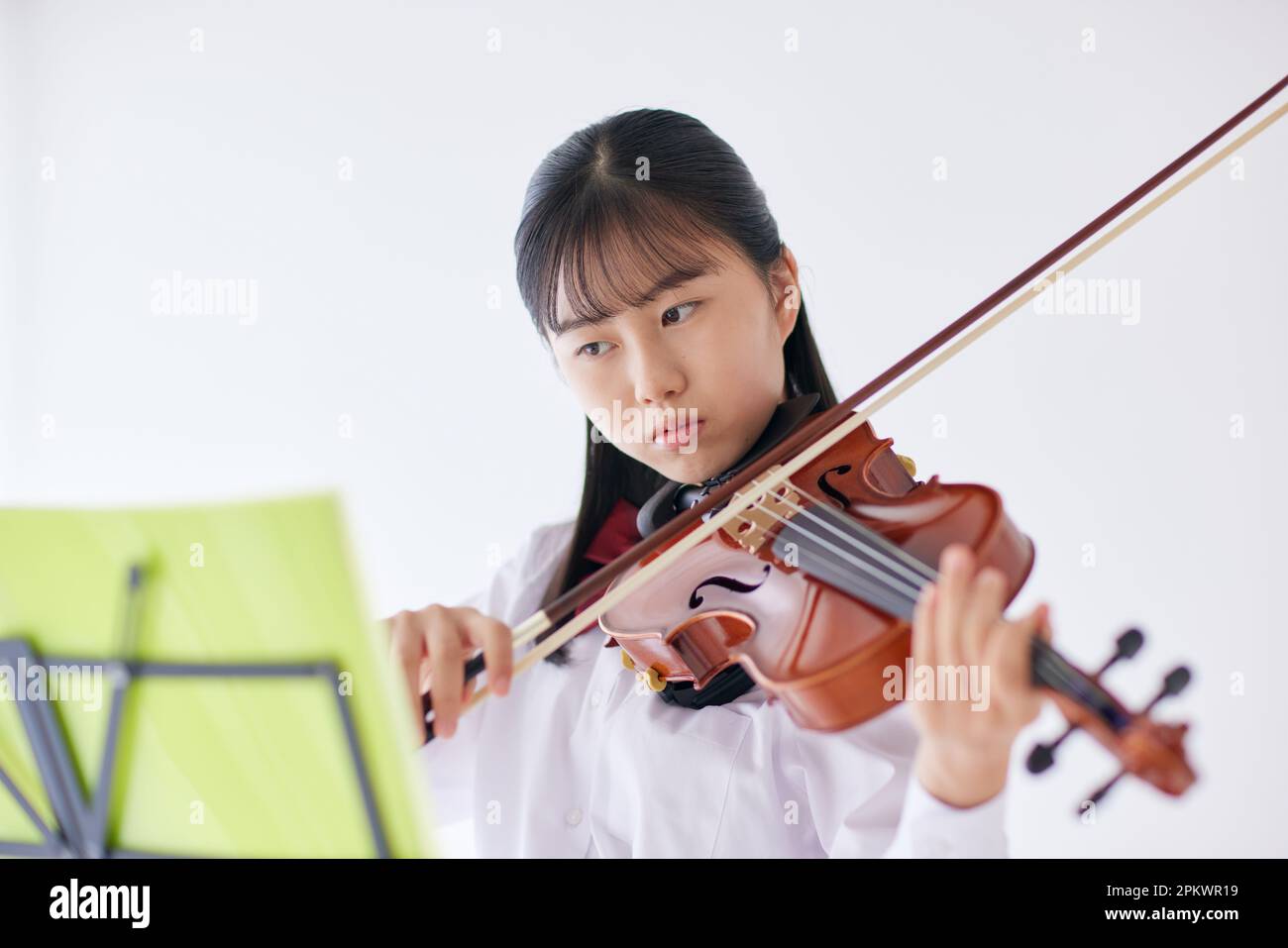 Japanese high school student wearing uniform practicing music Stock ...