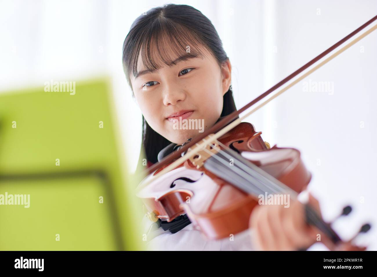 Japanese high school student wearing uniform practicing music Stock ...