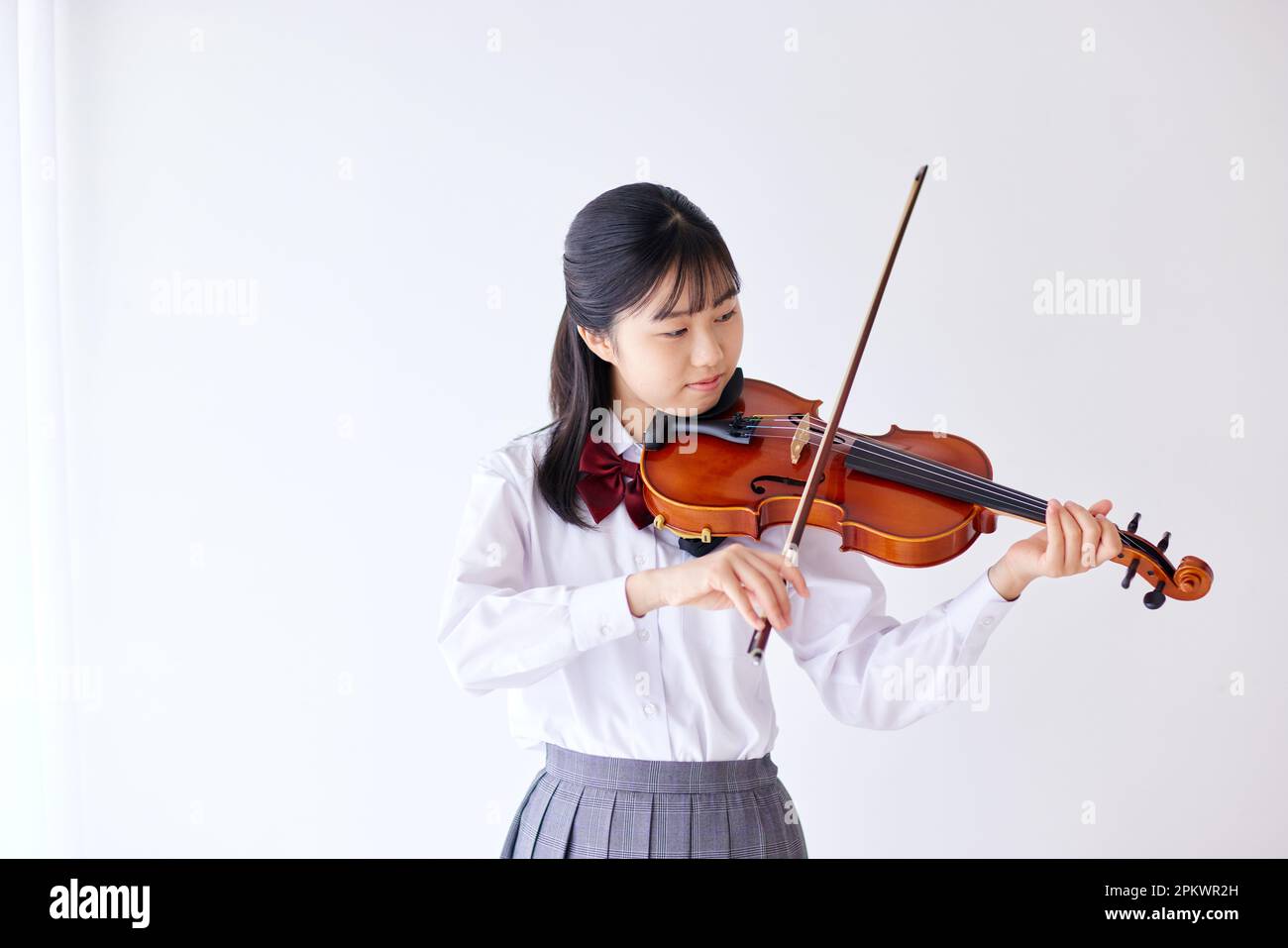Japanese high school student wearing uniform practicing music Stock ...