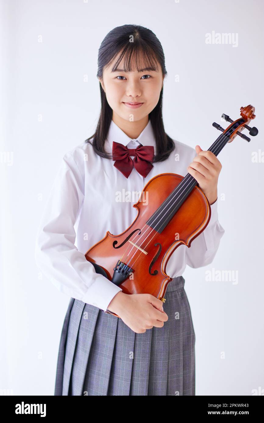 Japanese high school student wearing uniform practicing music Stock ...