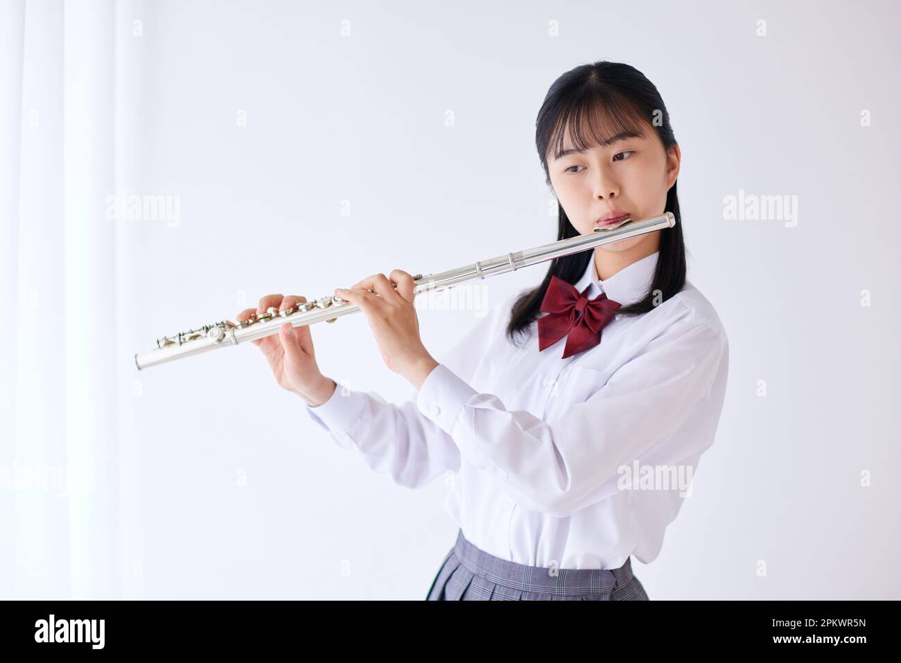 Japanese high school student wearing uniform practicing music Stock ...