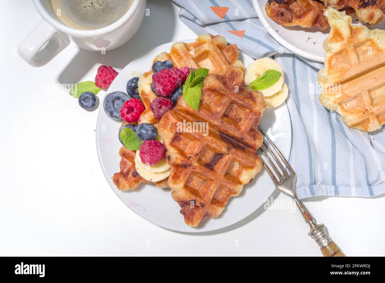 Modern dessert croffle - mixture of croissants and waffles, puff baking ...
