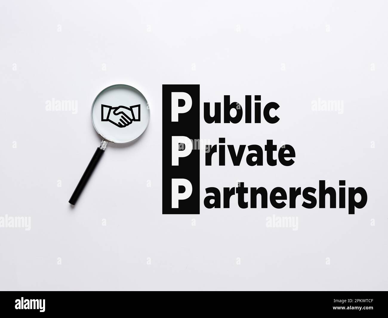 Magnifier magnifies the handshake agreement symbol with the word PPP Public Private Partnership ...