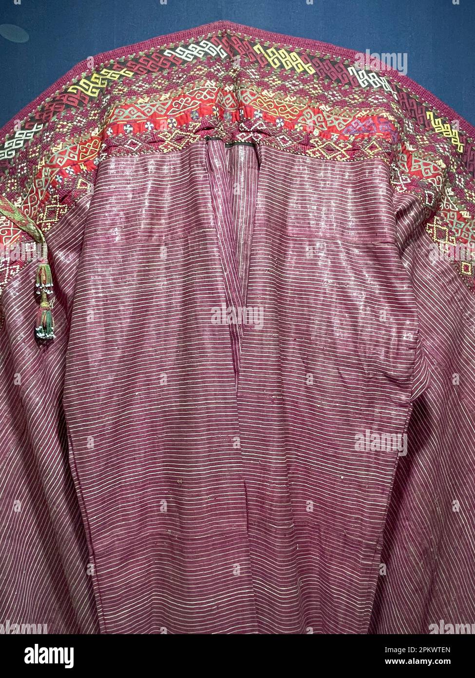 A traditional red Chapan, Caftan, Robe. At the Savitsky State Museum of ...