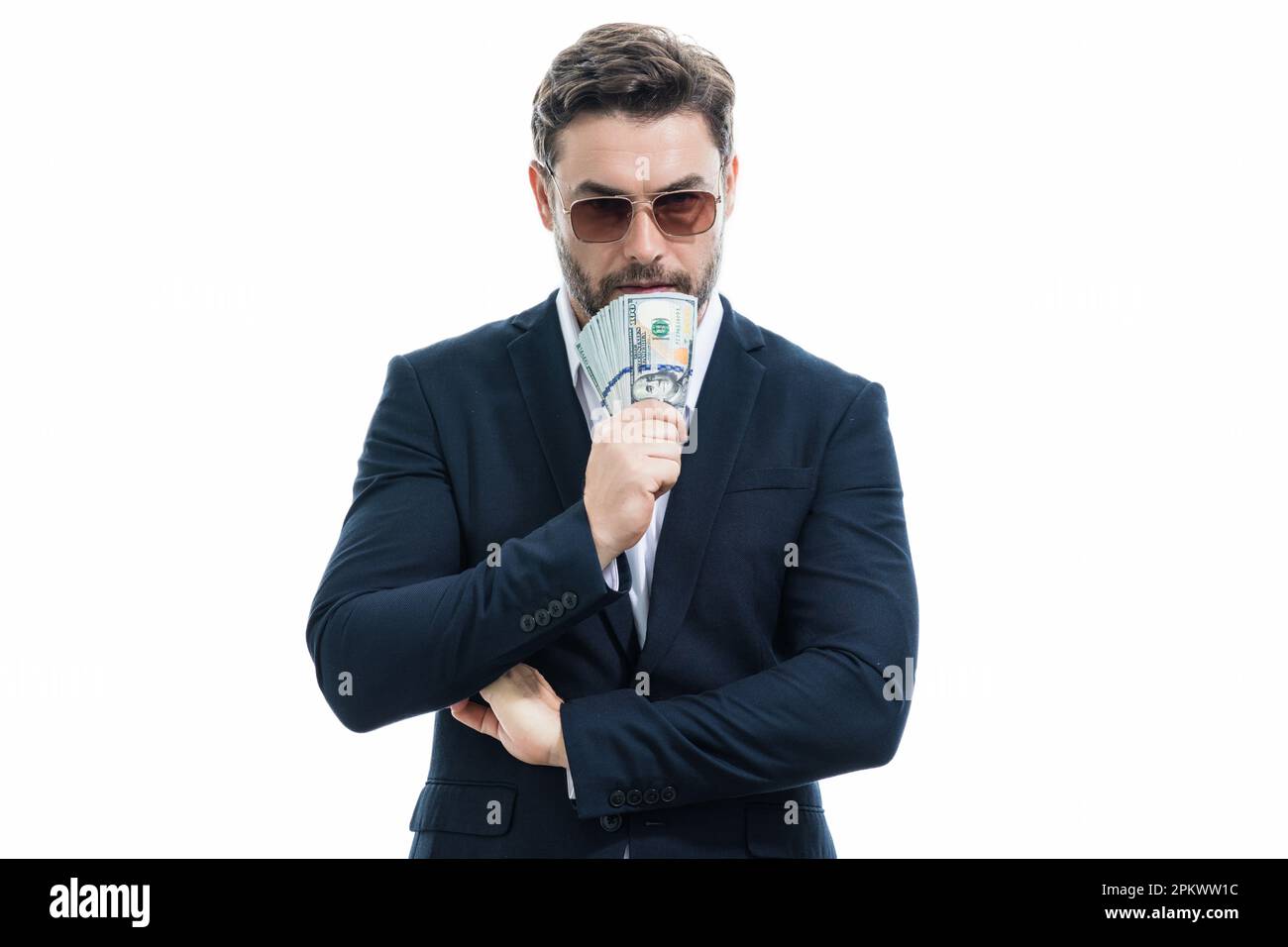 Good payment. Handsome business man holding money isolated over grey ...