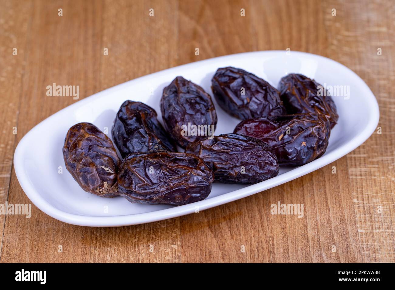 Date fruit. Naturally date palm fruit in a ceramic bowl. Ramadan food ...
