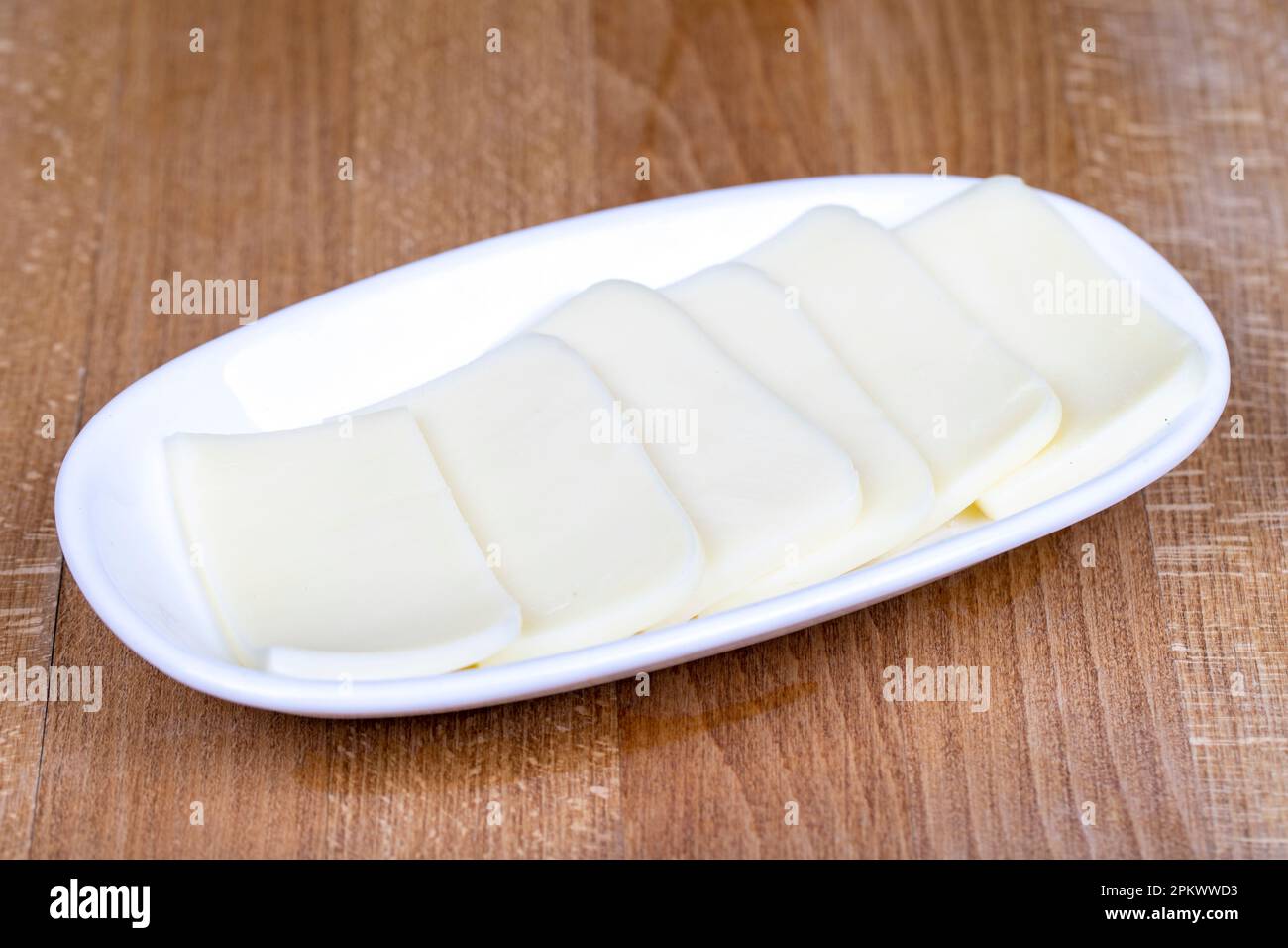 Cheddar cheese. Kashar cheese or kashkaval cheese in a ceramic bowl ...