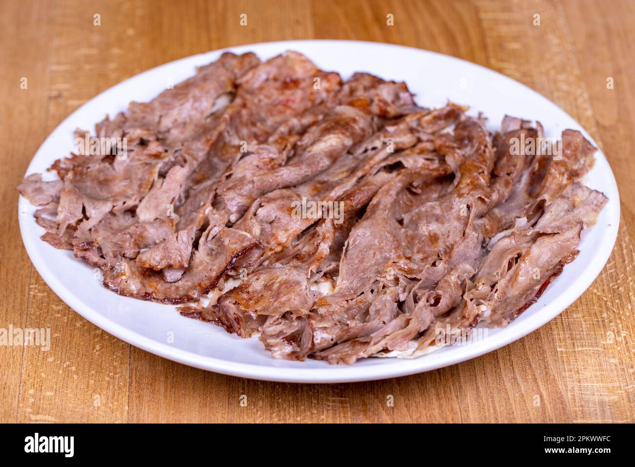 Meat doner kebab. Turkish doner kebab on wood floor. Turkish cuisine ...