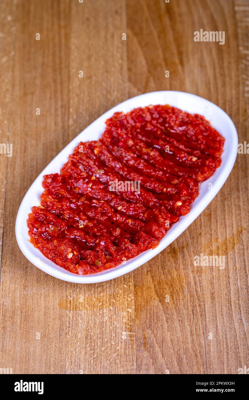 Chili paste. Hot snack prepared with pepper paste in a ceramic bowl ...