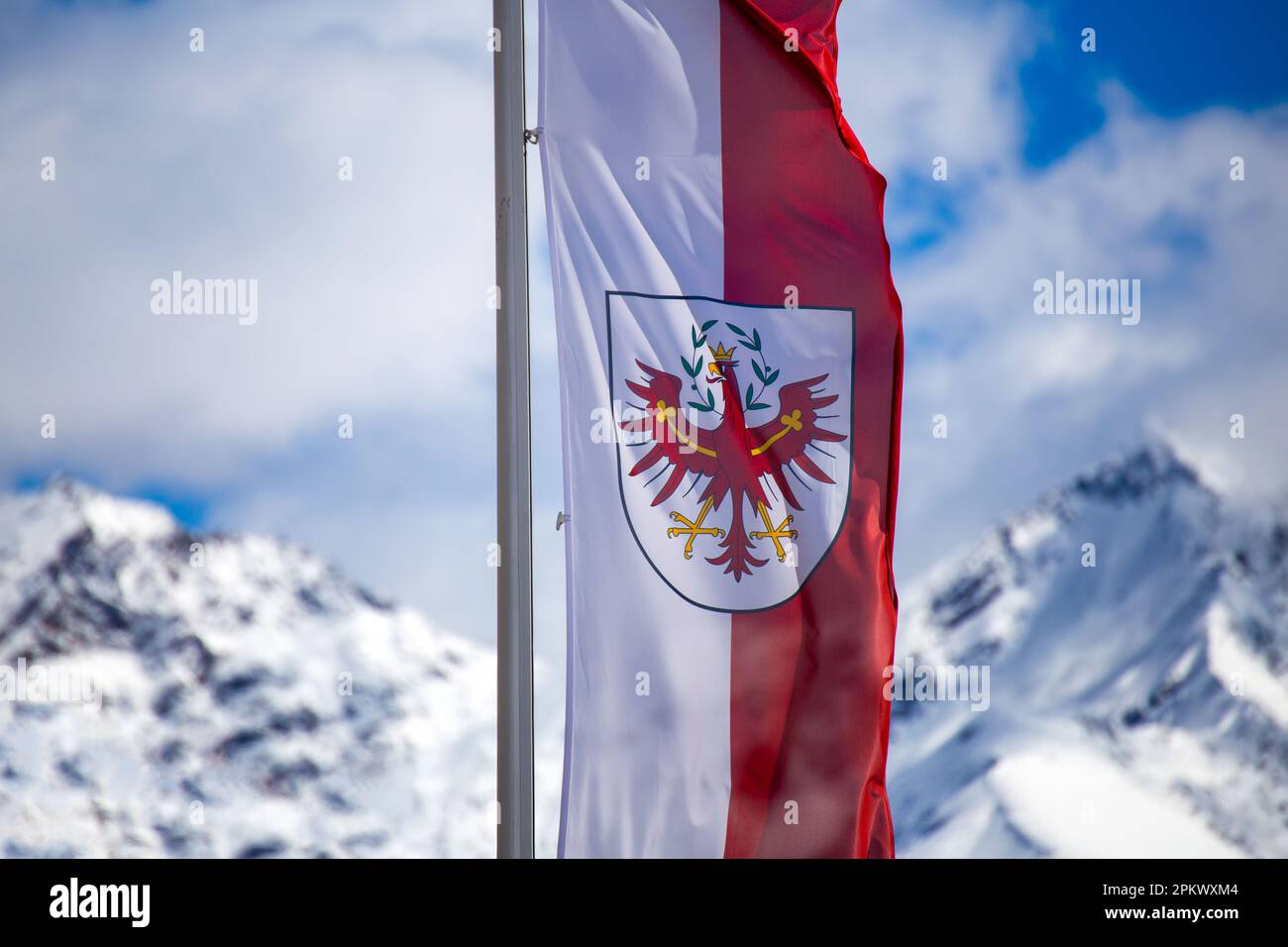 Flag of Tyrol with mountains in the background Stock Photo - Alamy