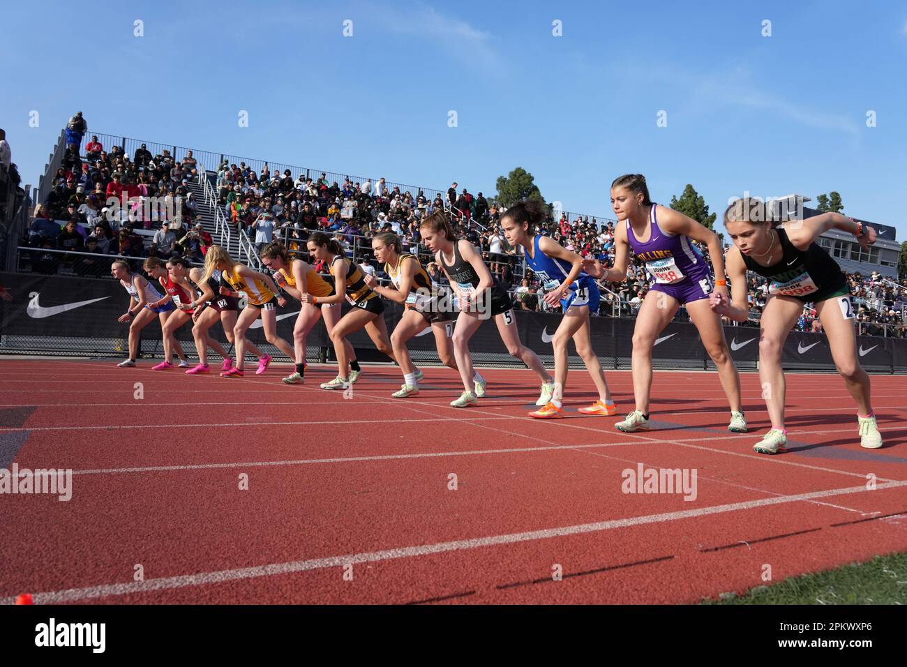 A general overall view of runners at the starting line of the girls ...