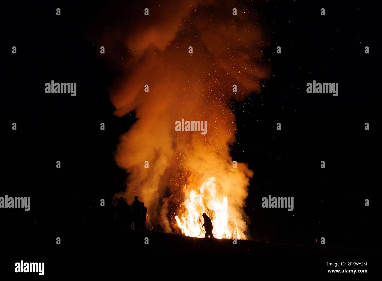 09 April 2023, North Rhine-Westphalia, Attendorn: An Easter fire, here ...