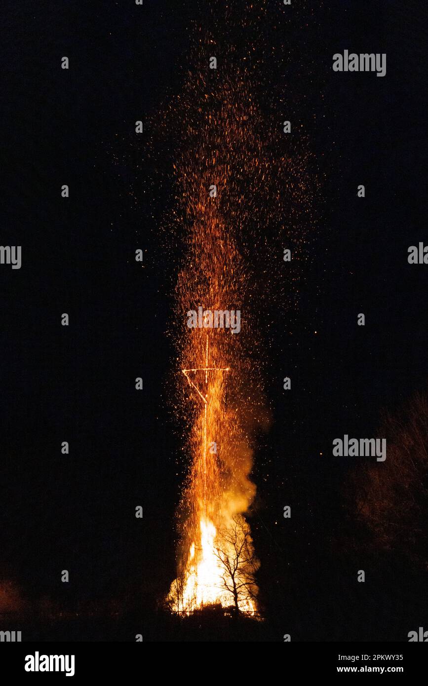 09 April 2023, North Rhine-Westphalia, Attendorn: An Easter fire, here ...