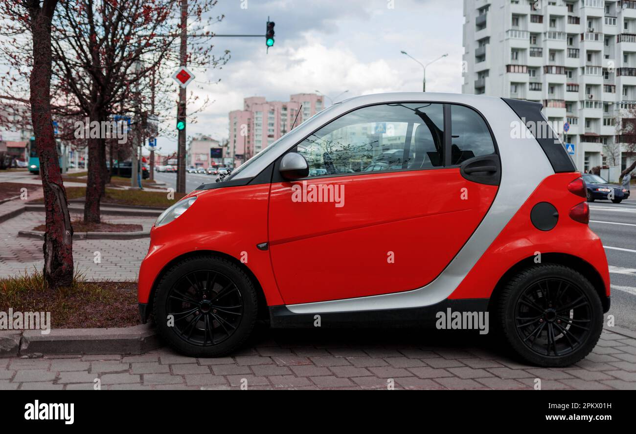 Minsk, Belarus, March 2023 - - side view of red small Mercedes smart ...