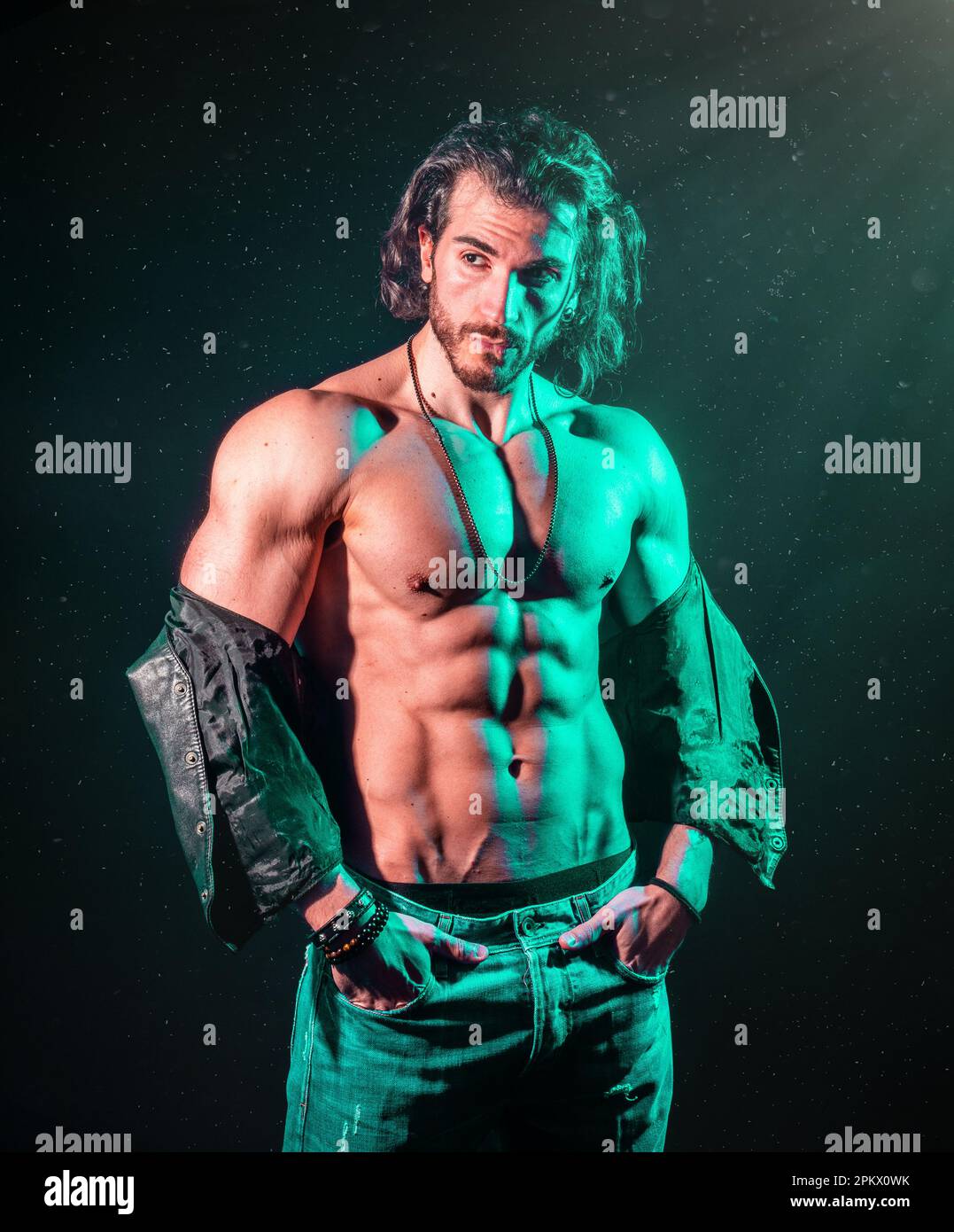 Confident, attractive young man with open vest on Stock Photo - Alamy