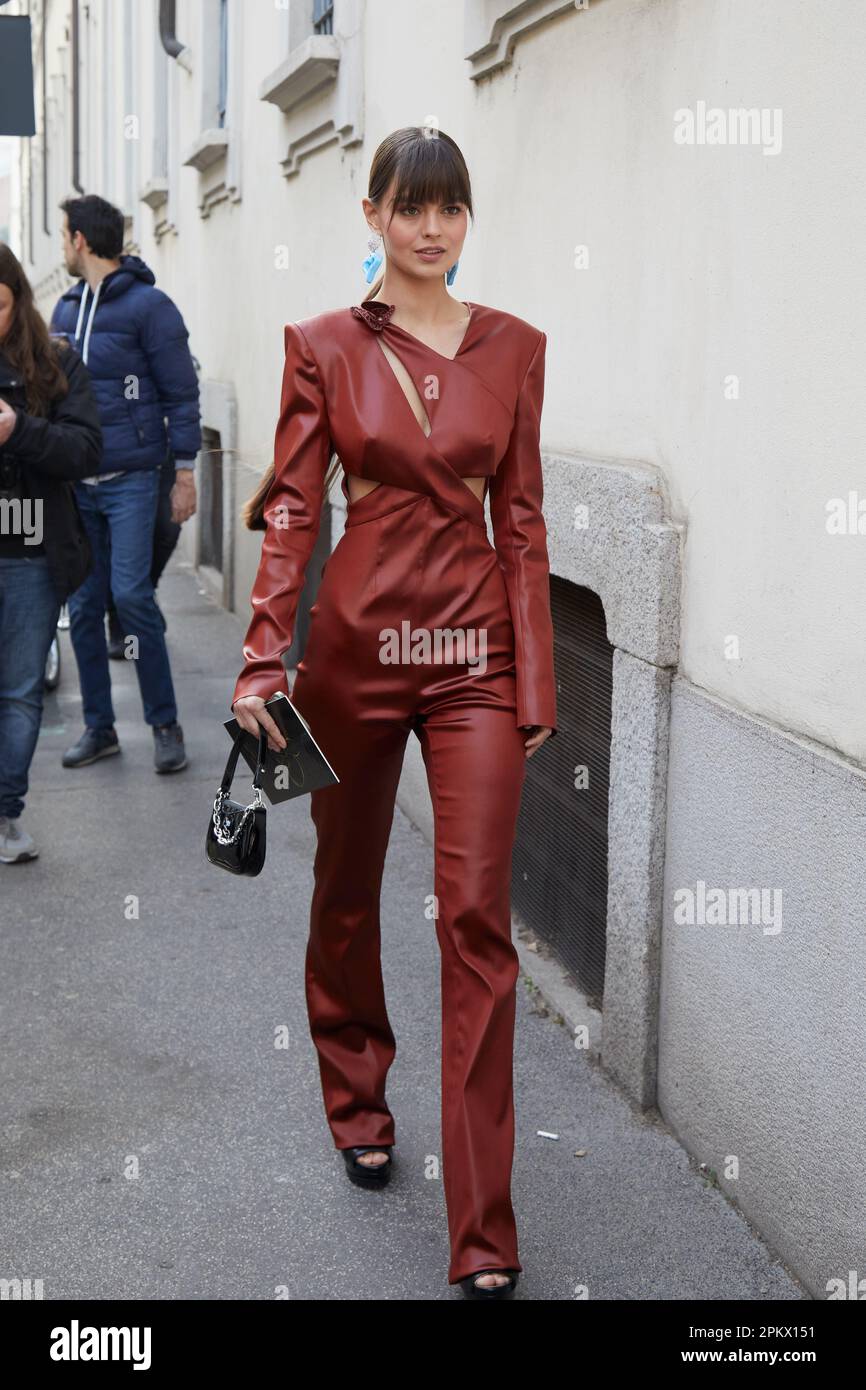 MILAN, ITALY - FEBRUARY 23, 2023: Woman with brown jumpsuit before ...