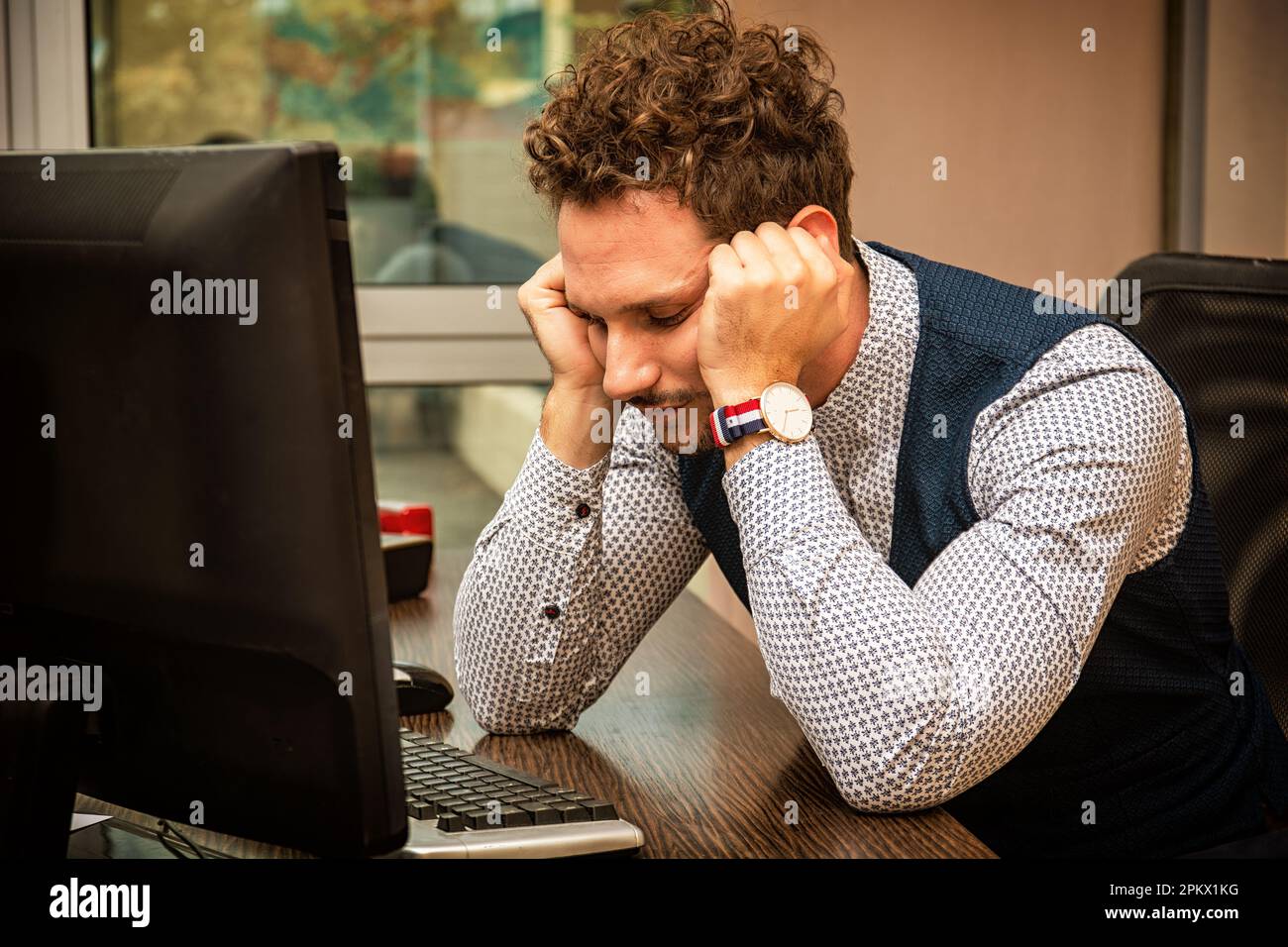 Preoccupied, worried male worker staring at computer Stock Photo - Alamy