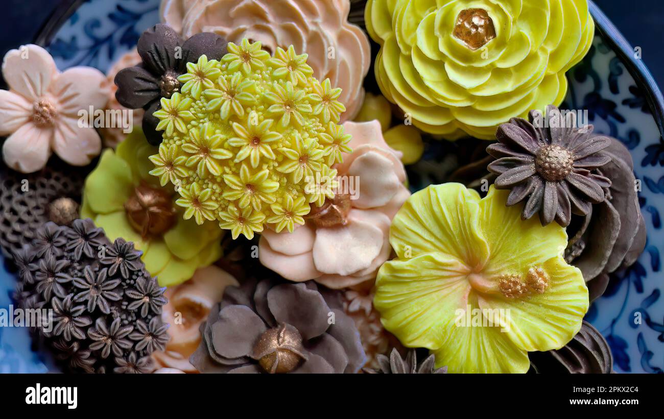 Close up Thai dessert various flower shaped and flavors, mango, orange ...