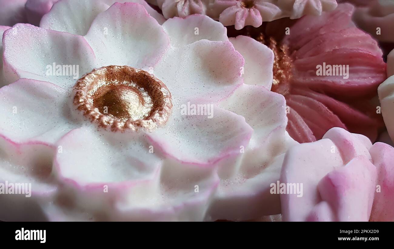Close up Thai dessert various flower shaped in pastel pink color tone ...