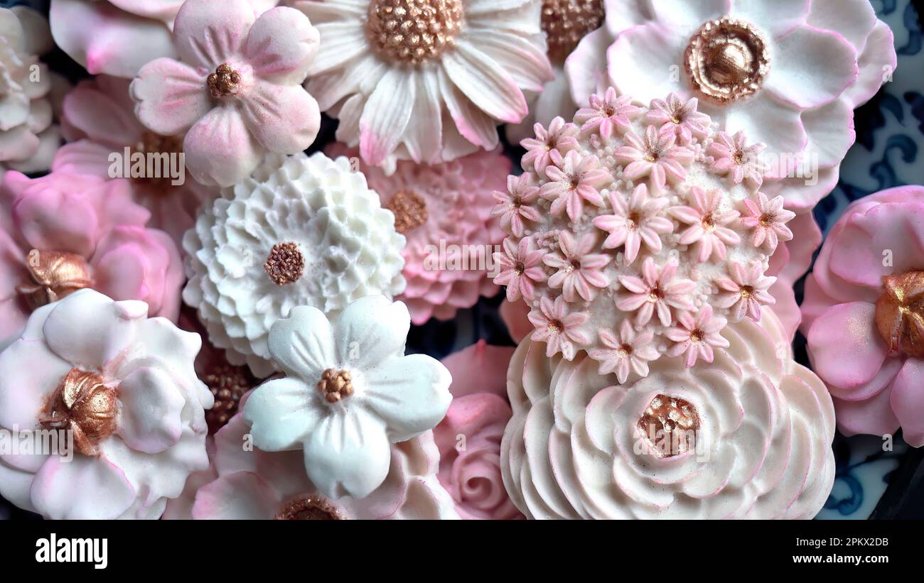 Close up Thai dessert various flower shaped in pastel pink color tone ...