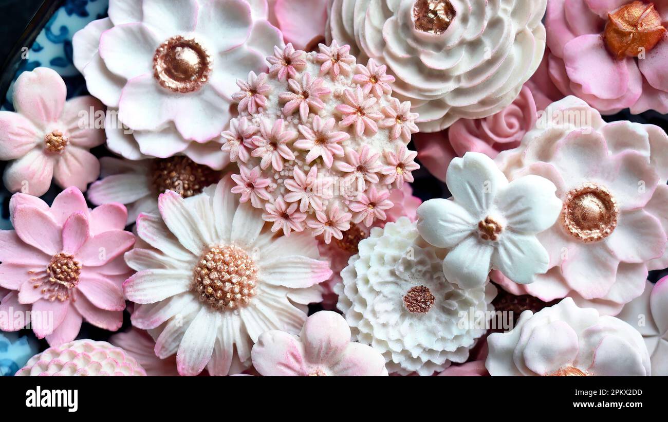 Close up Thai dessert various flower shaped in pastel pink color tone ...