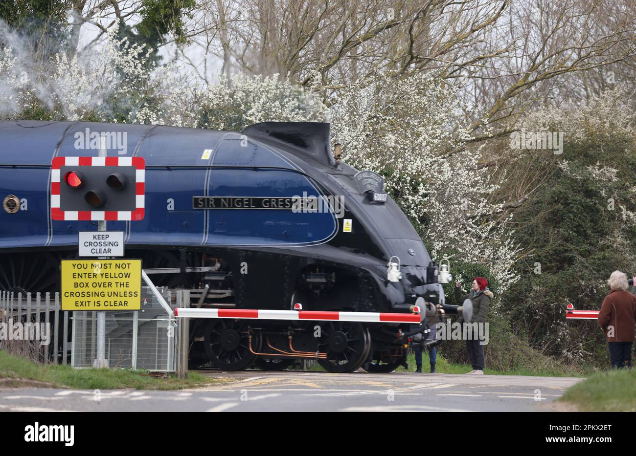 People watch the steam locomotive Sir Nigel Gresley 60007, looking ...