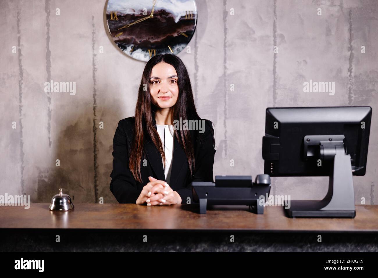 Portrait of receptionist at desk in lobby. Banner design. Friendly ...
