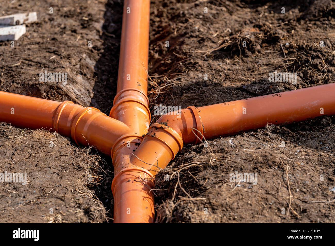 sewage system made of plastic PVC pipes in the ground Stock Photo - Alamy