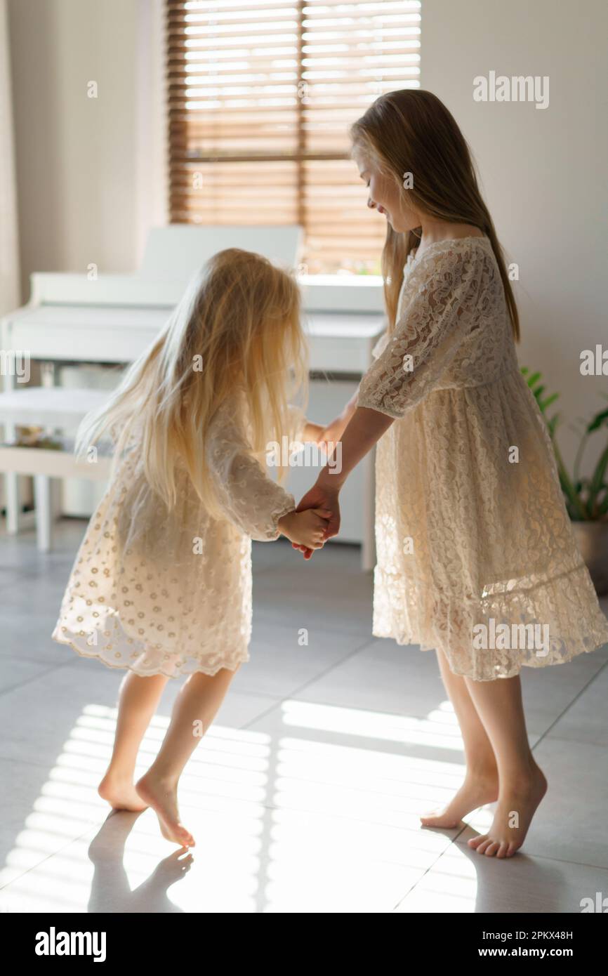 Two girls dancing together hi-res stock photography and images - Alamy