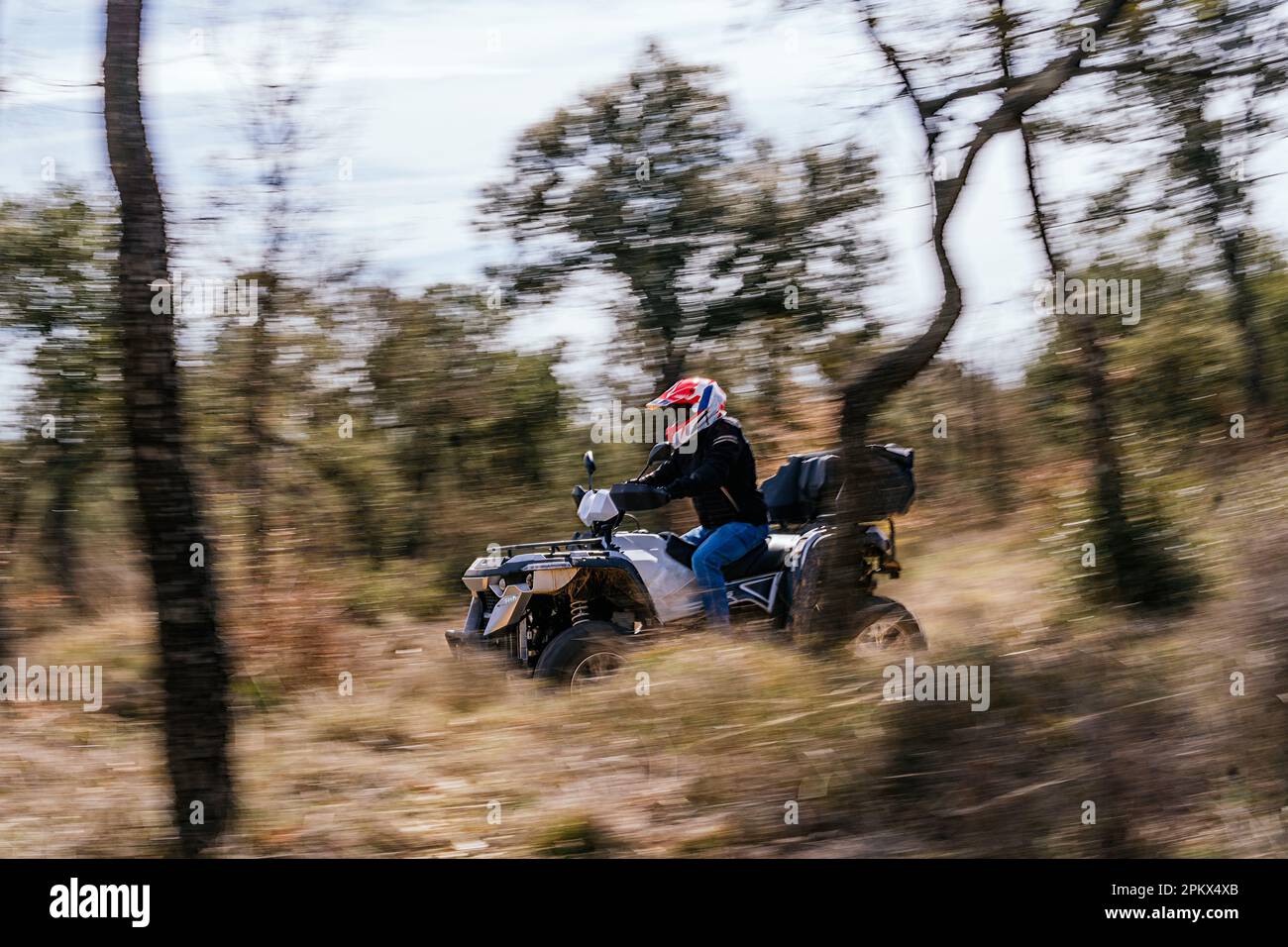 Young man riding a quad bike hi-res stock photography and images - Alamy