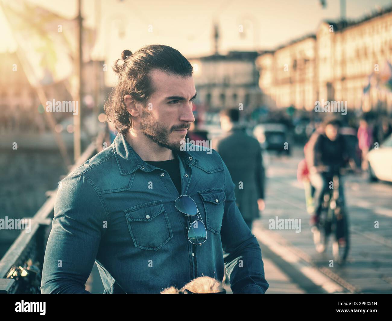 One handsome young man in urban setting in European city, Turin in ...