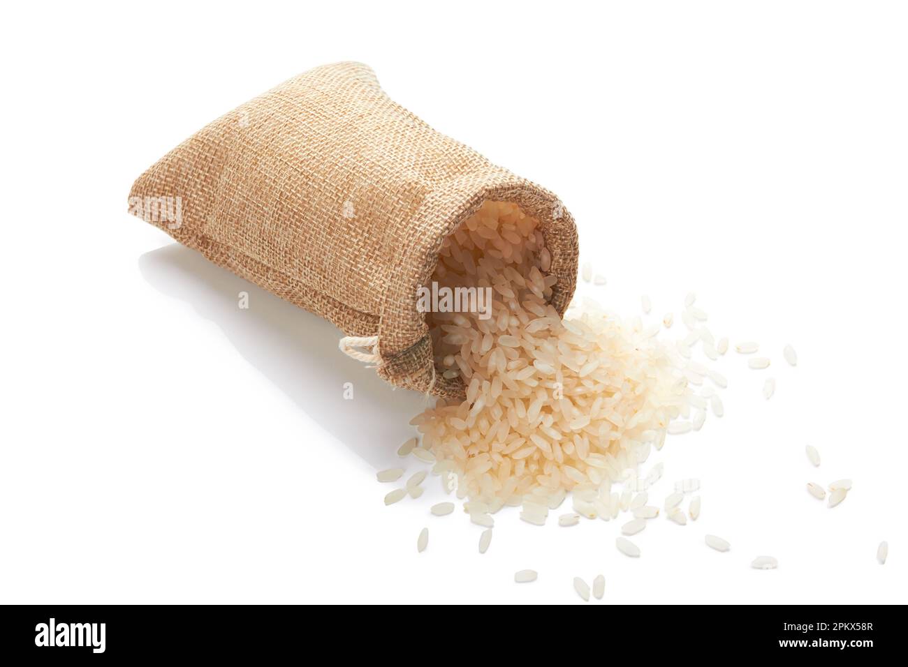Rice in bag isolated on a white background Stock Photo - Alamy