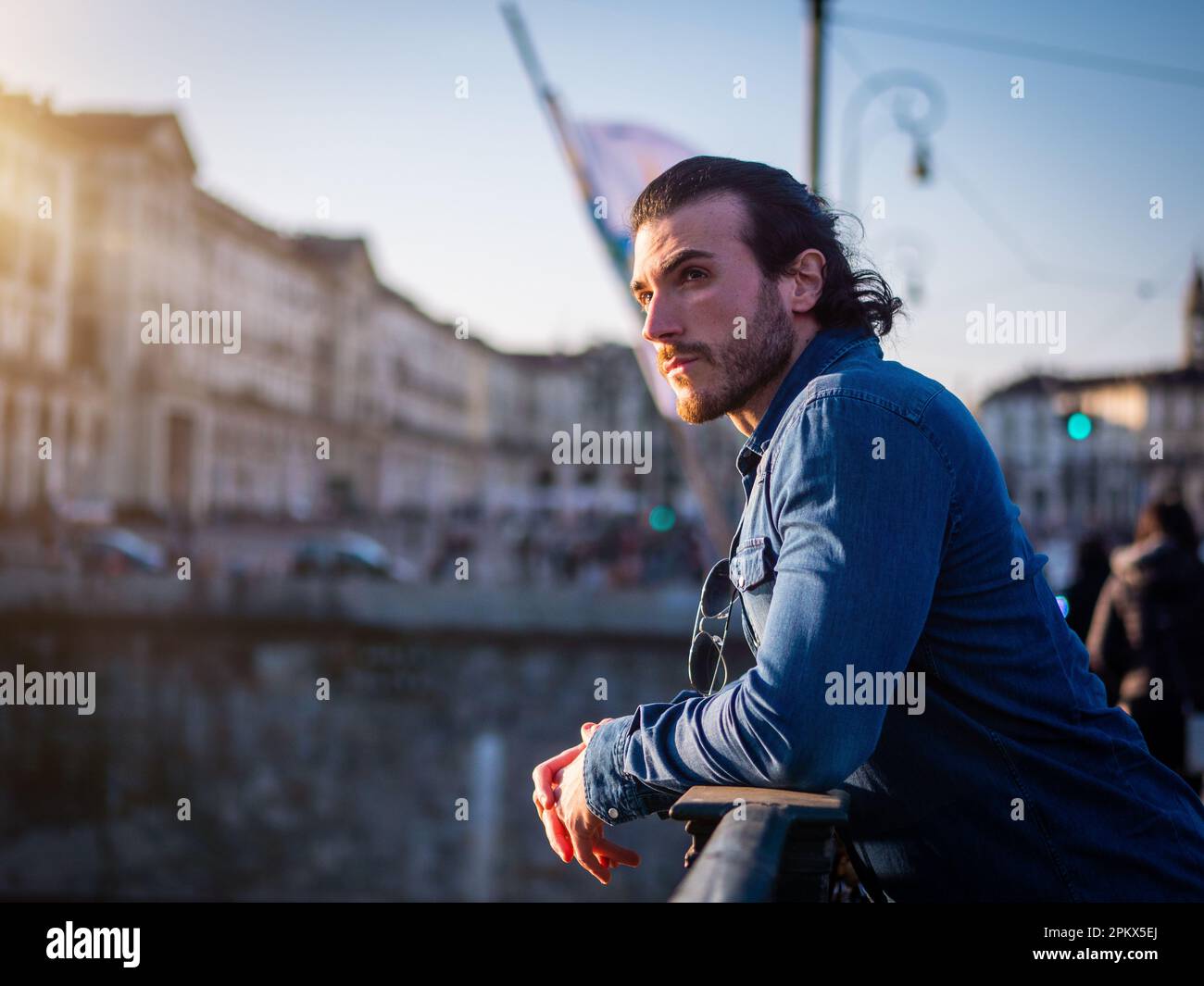 One handsome young man in urban setting in European city, Turin in ...