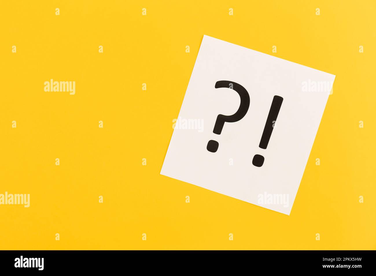 Question mark and exclamation mark on yellow background, flat lay Stock ...