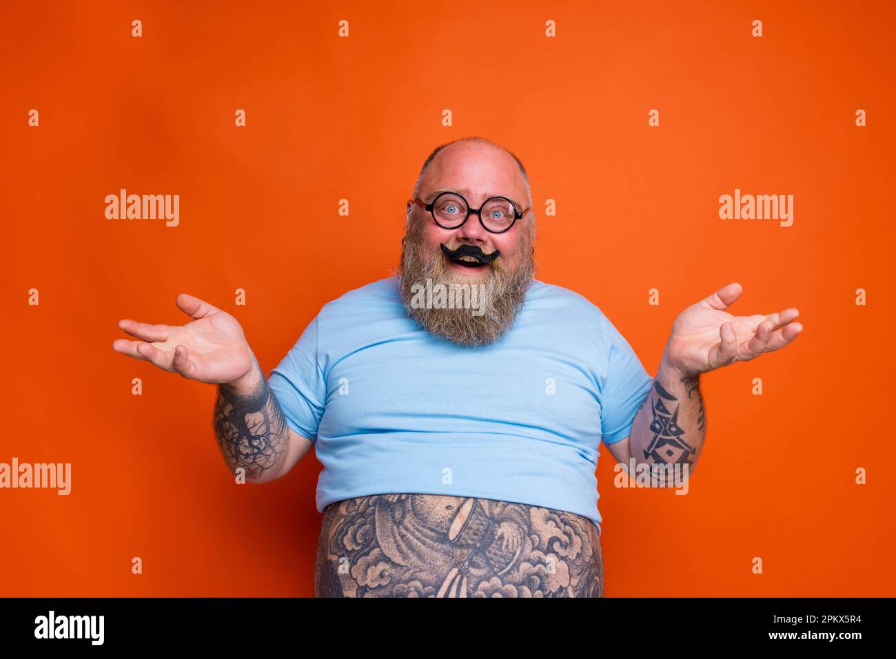 Confused fat thoughtful man acts like a nerd person Stock Photo - Alamy