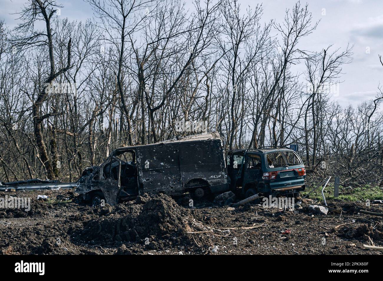 Cars covered with bullet holes are seen on the road of Bakhmut, the ...