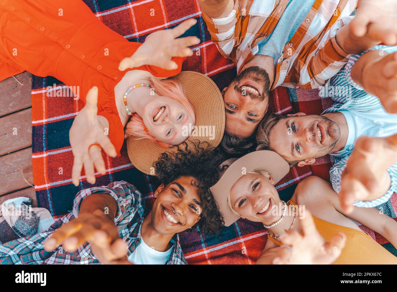 Group of friend relax together lying down in summer Stock Photo - Alamy