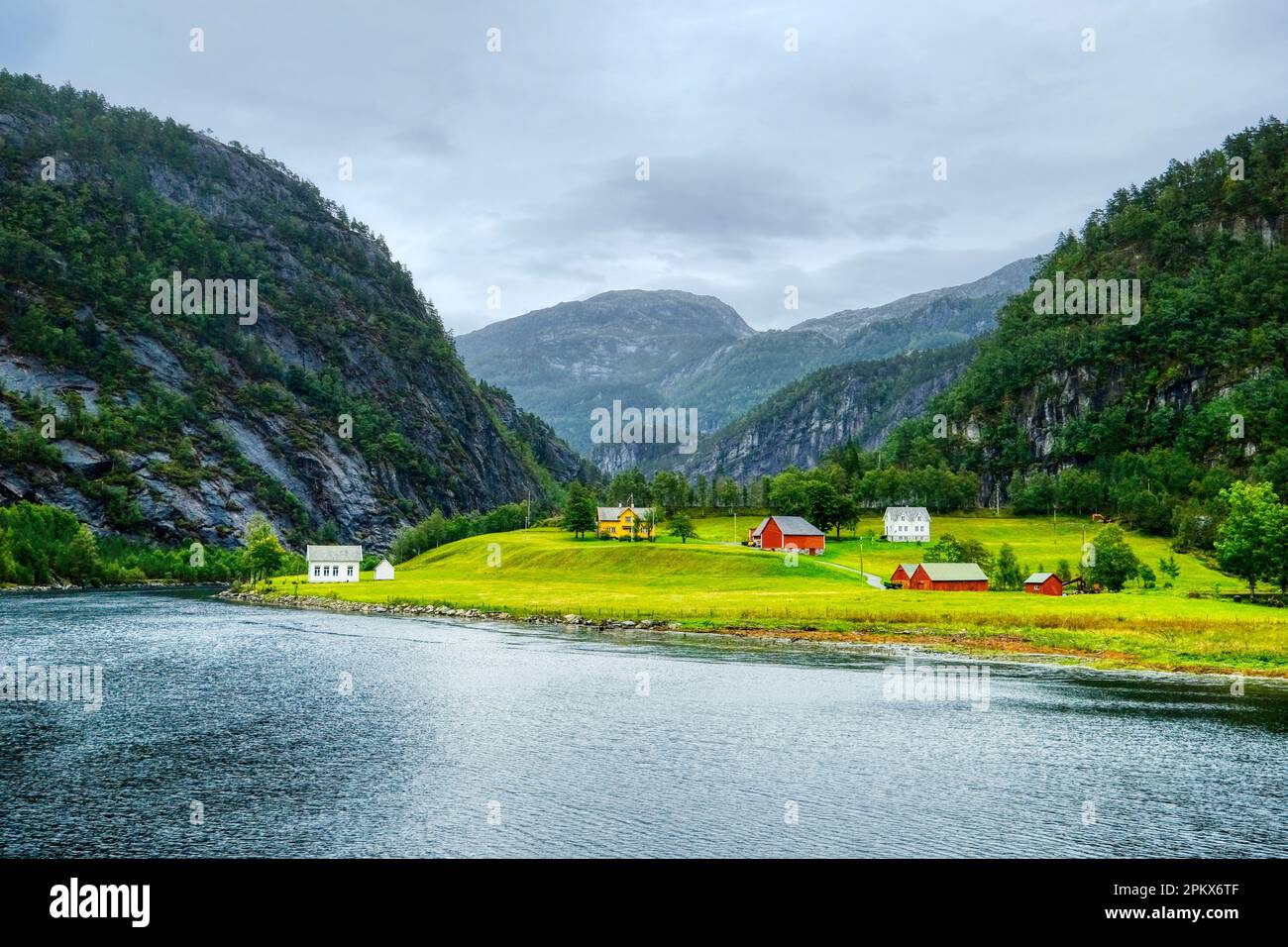 A stunning landscape of a lush green valley surrounded by rolling ...