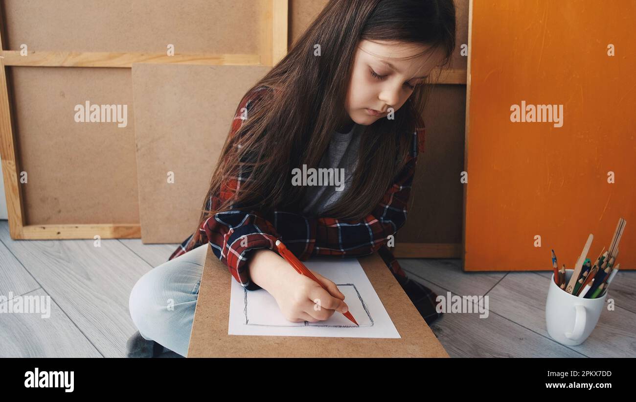 Painting school drawing girl creative task child Stock Photo - Alamy