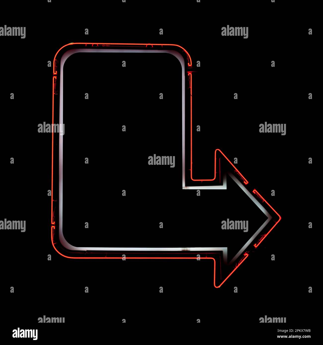 Big red neon light shaped into an arrow turning right isolated on a ...
