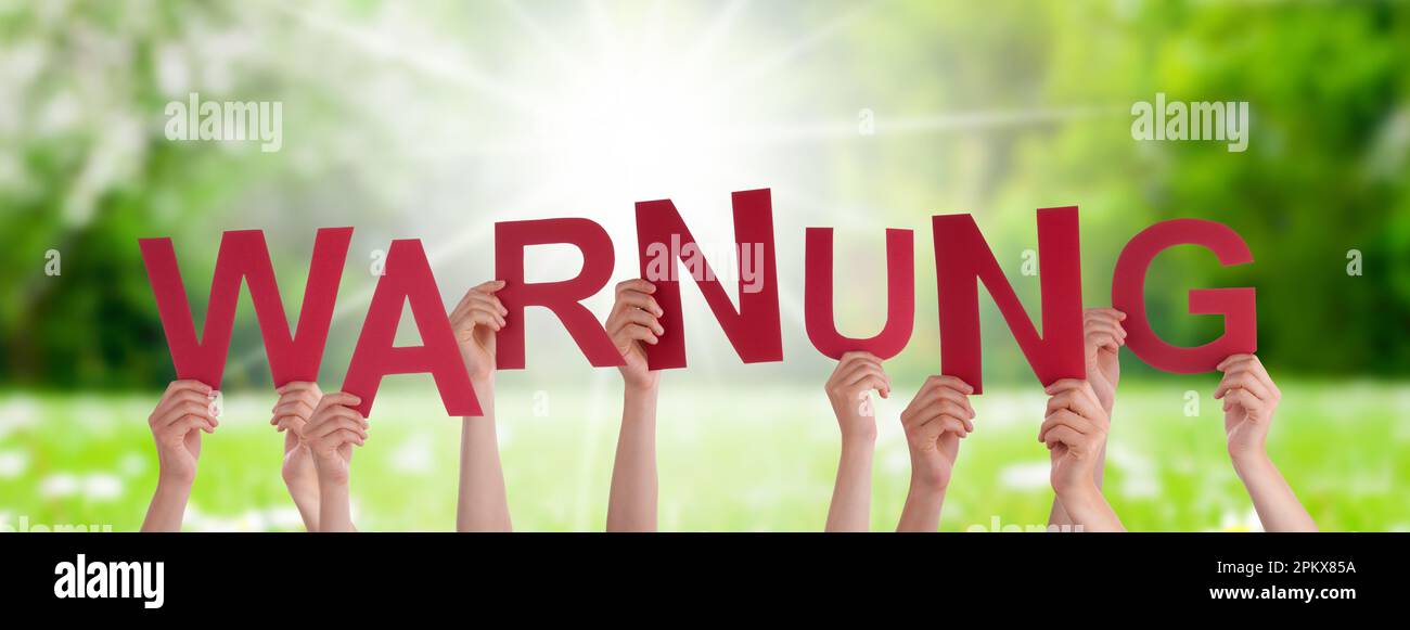 People Hands Building Word Warnung Means Warning, Grass Meadow Stock ...